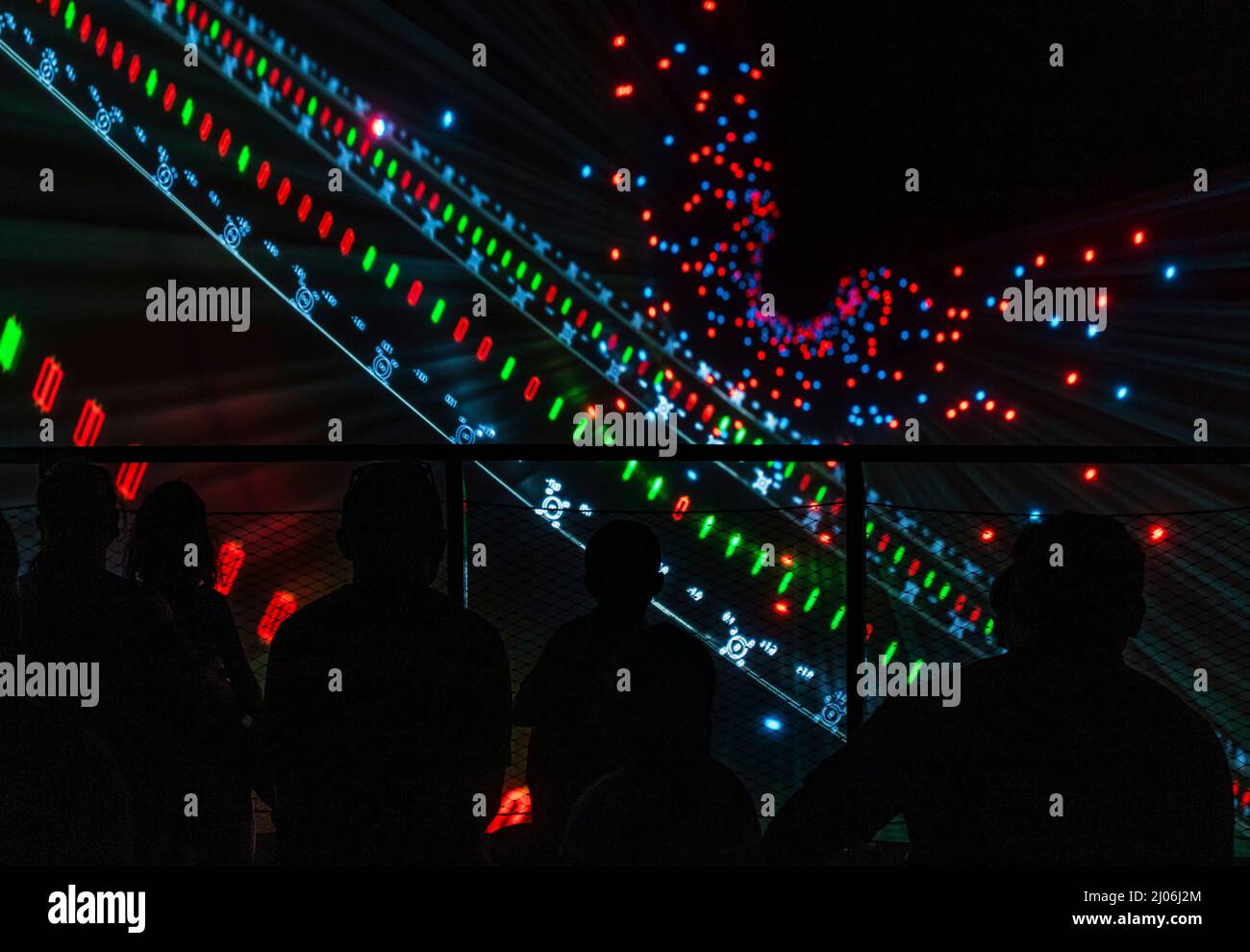 People watching video reel projected on the wall Stock Photo - Alamy