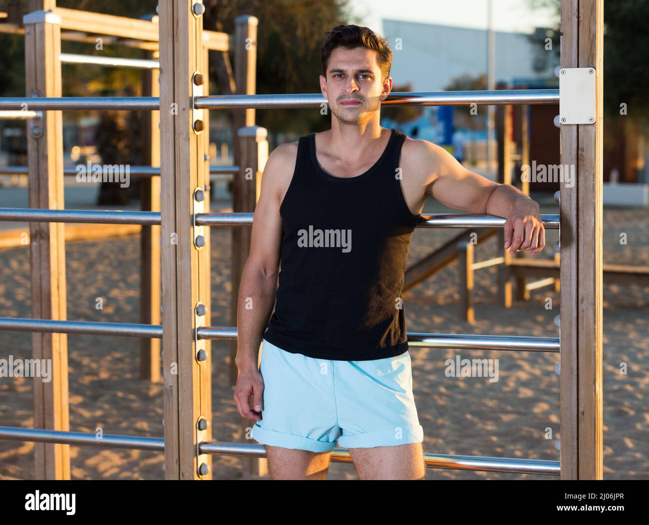 Confident athletic man taking break during morning workout outdoor ...