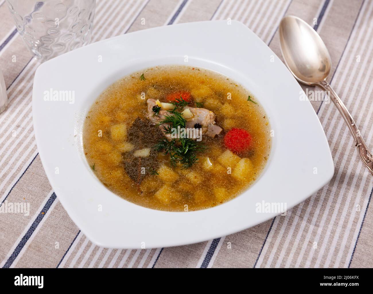 Appetizing soup in pork broth with potatoes, carrots and onions ...