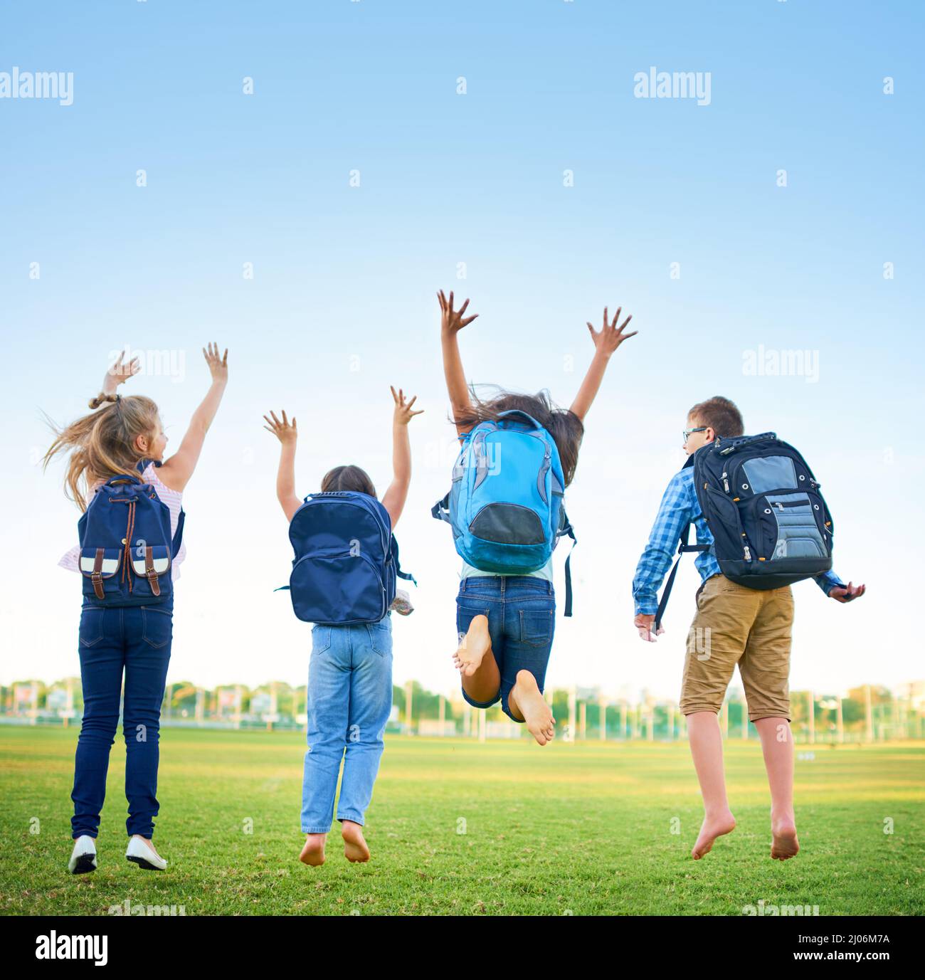 School children jumping outdoors hi-res stock photography and images ...