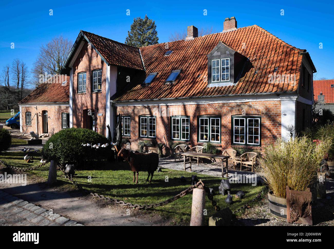 Panker, Germany. 11th Mar, 2022. A historic building with a store for ...