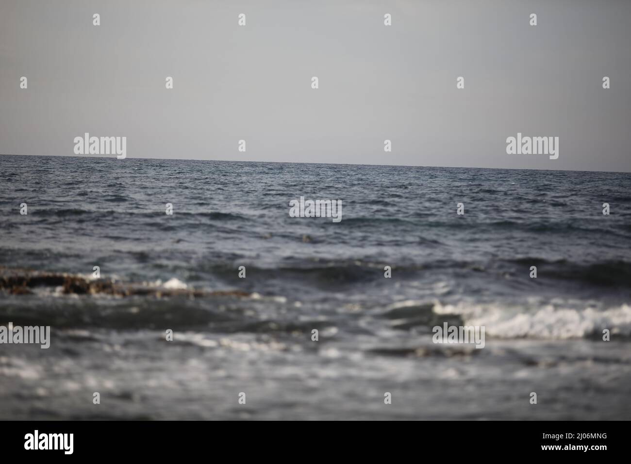 low waves on the shore of a beach High quality Stock Photo - Alamy