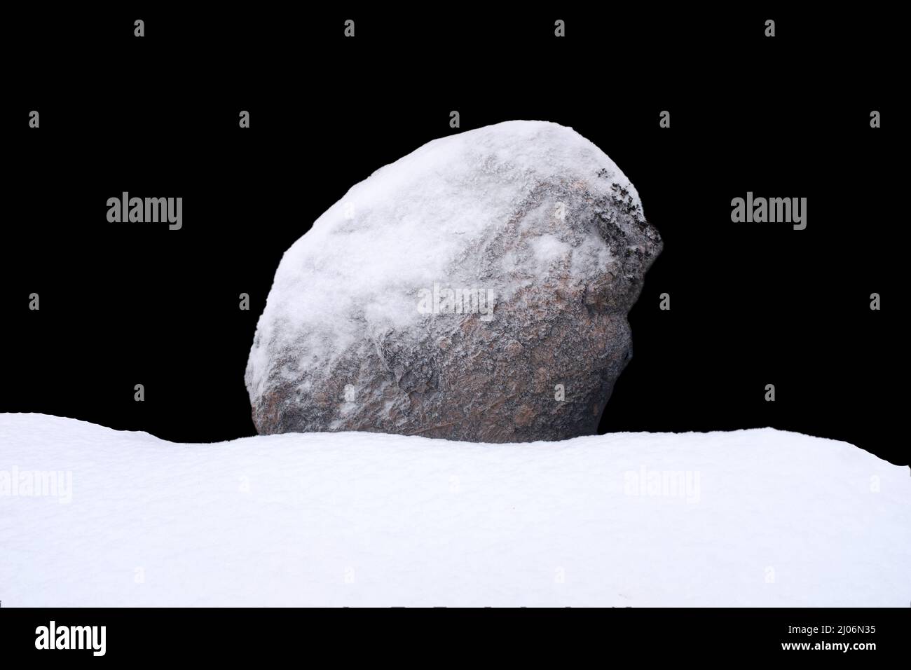 natural stone in snow isolated on black background. High quality photo ...