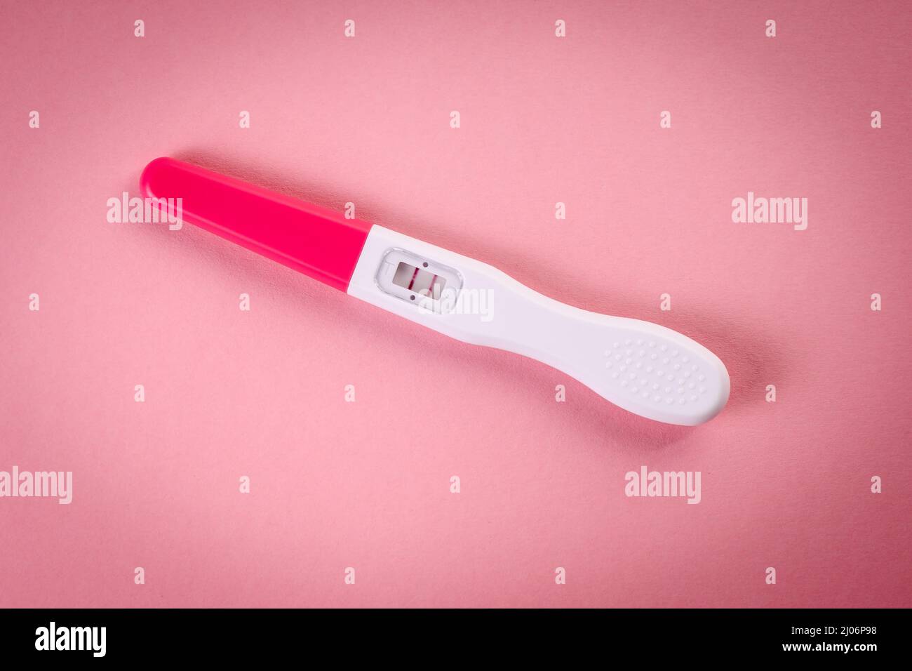 Positive pregnancy test on a pink background. New life concept Stock ...