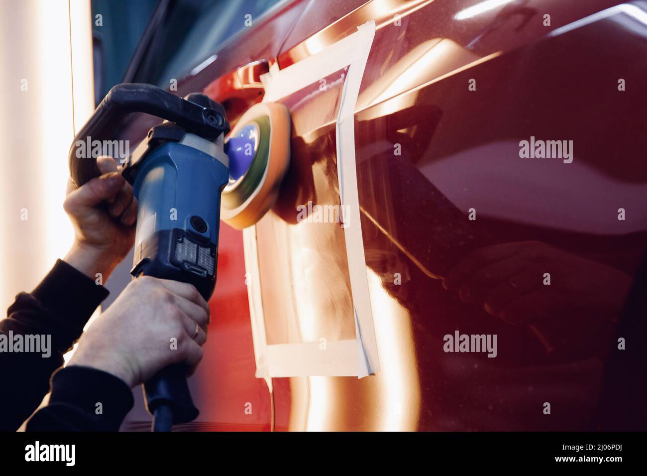 Master mechanic removal of dents defects auto repairman grinding ...