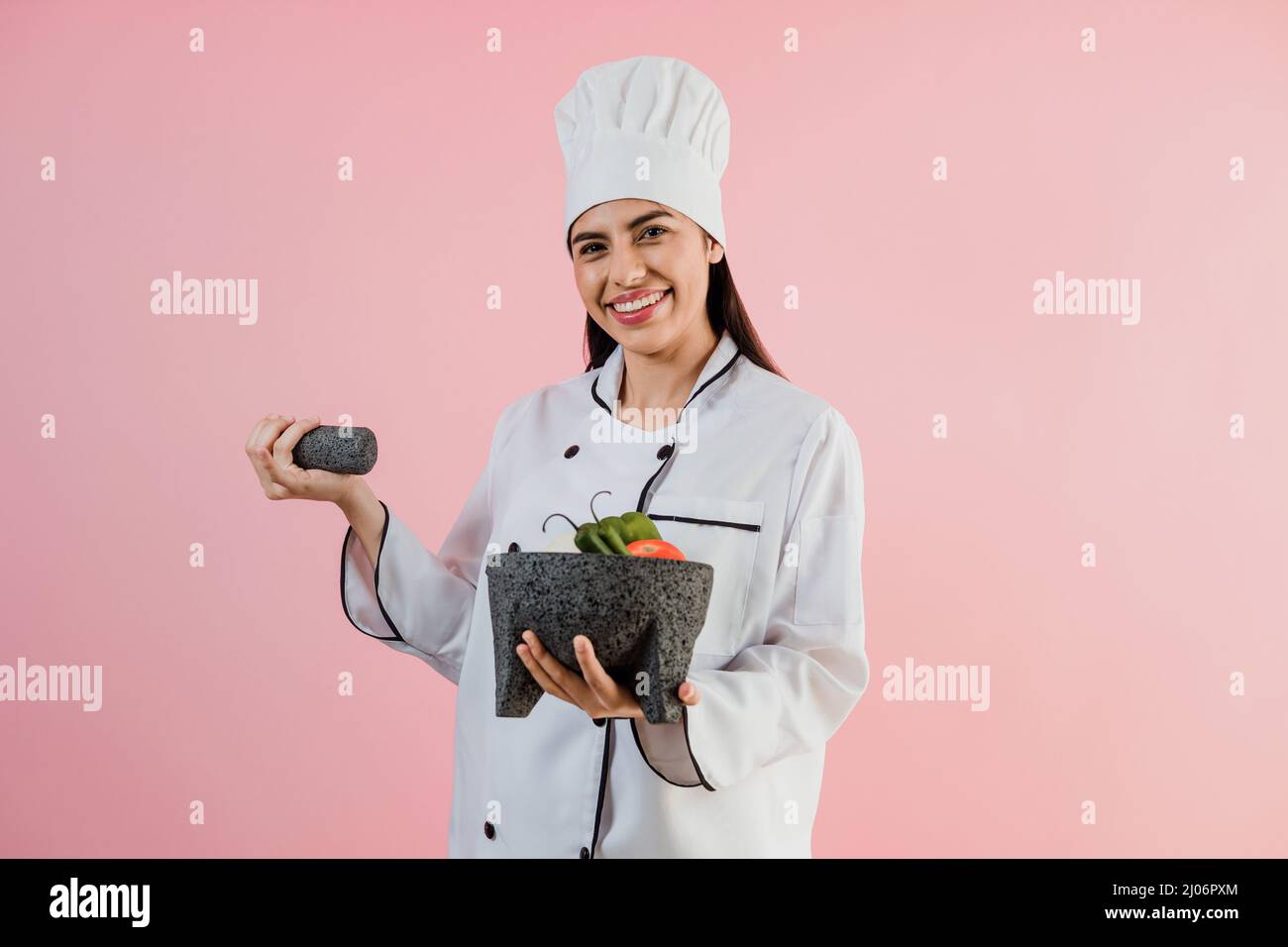 younh hispanic woman wearing chef hat with ingredients on traditional ...