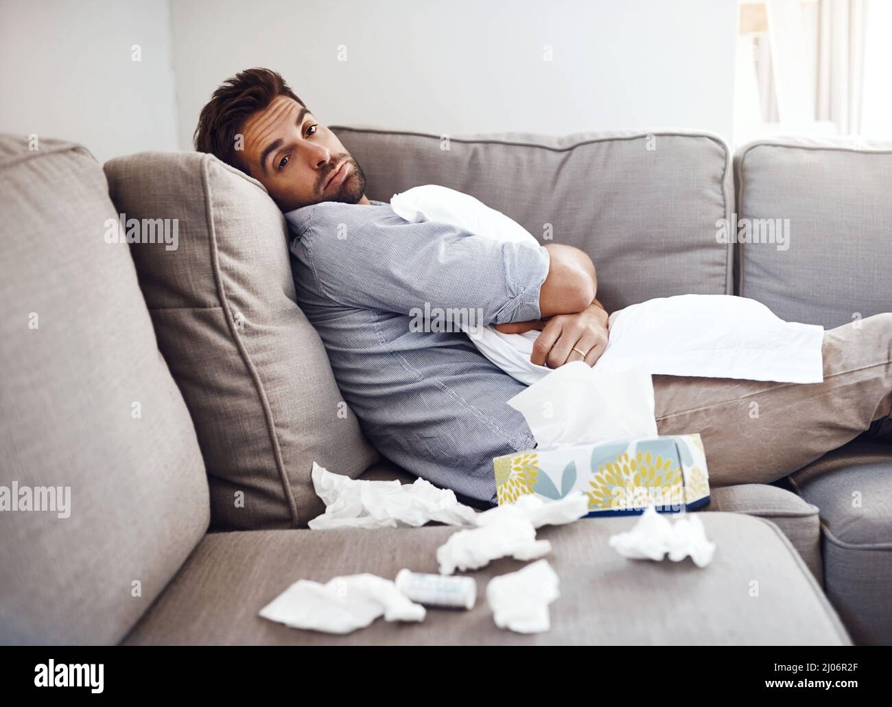 Anyone want to trade places. Portrait of a sickly young man holding a ...