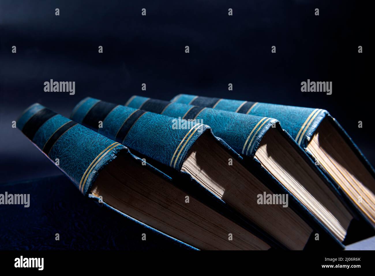 Stack of books with dark background Stock Photo - Alamy