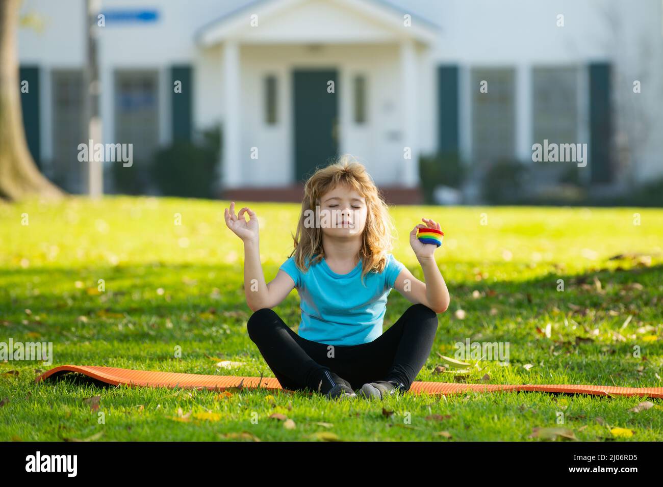 Child doing exercise outdoors. Healthy kids lifestyle. Yoga children in ...