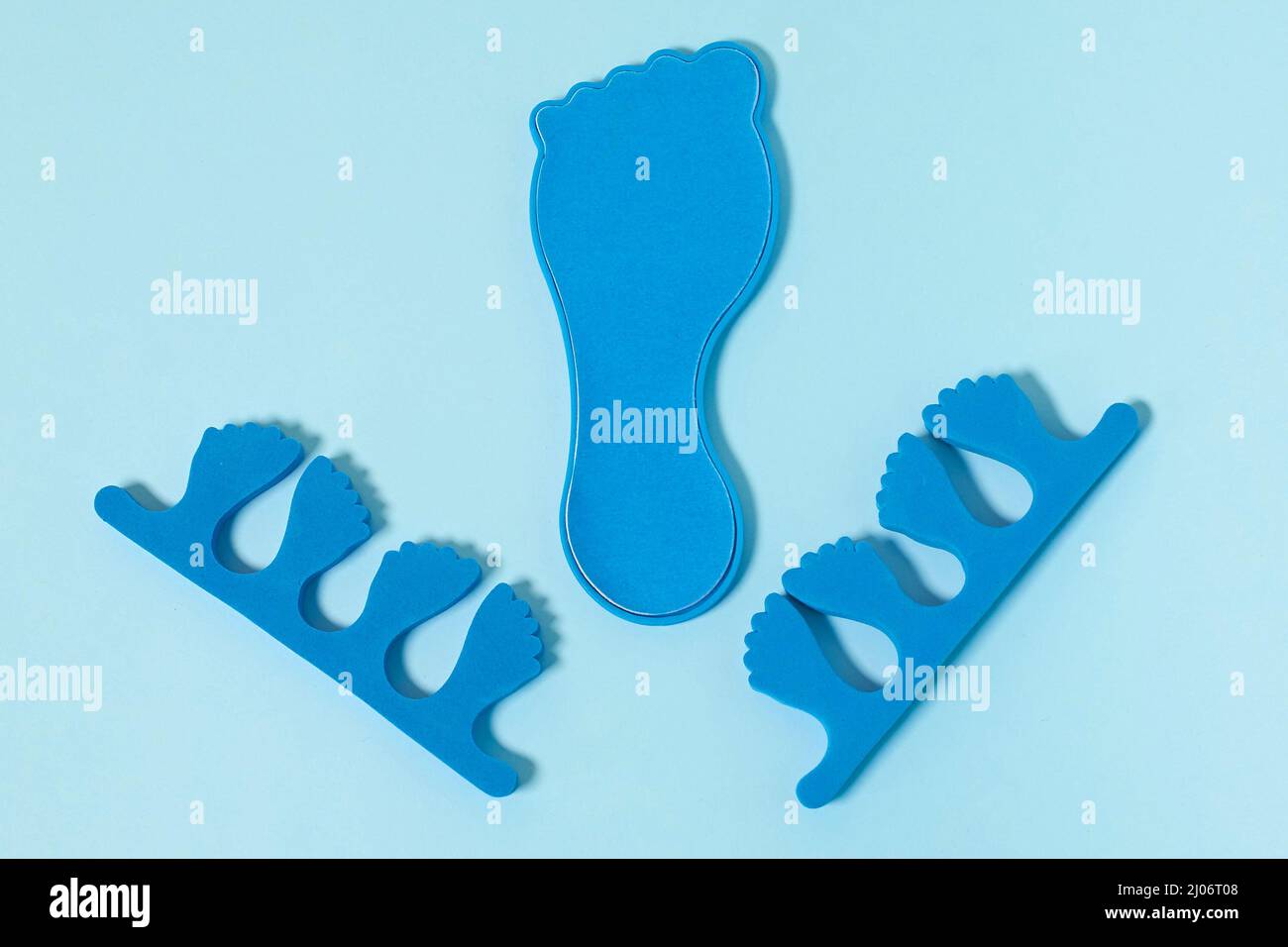 Pedicure kit. Finger separators and pedicure grater Stock Photo - Alamy
