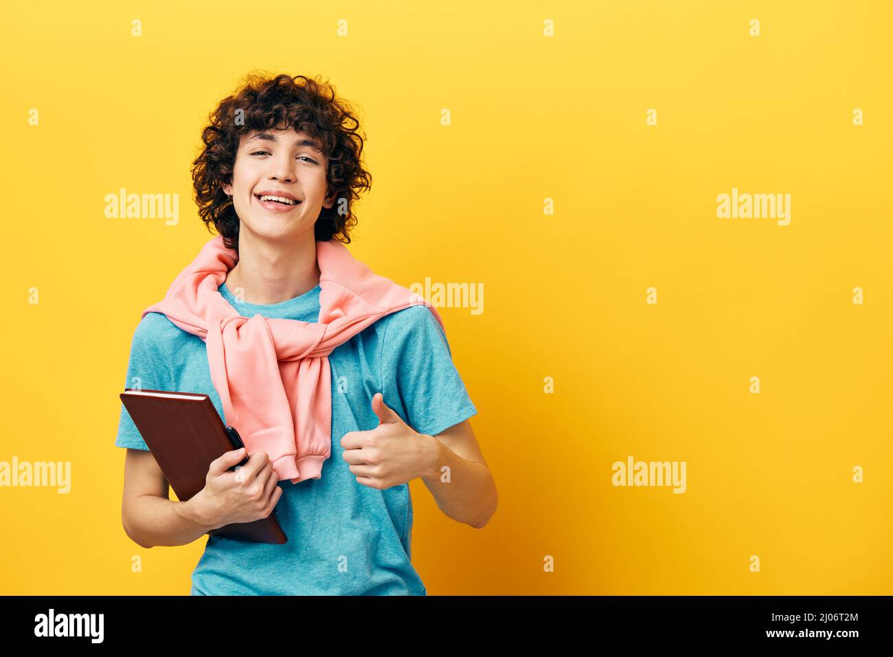 student education with notepad hand gesture yellow background Stock ...