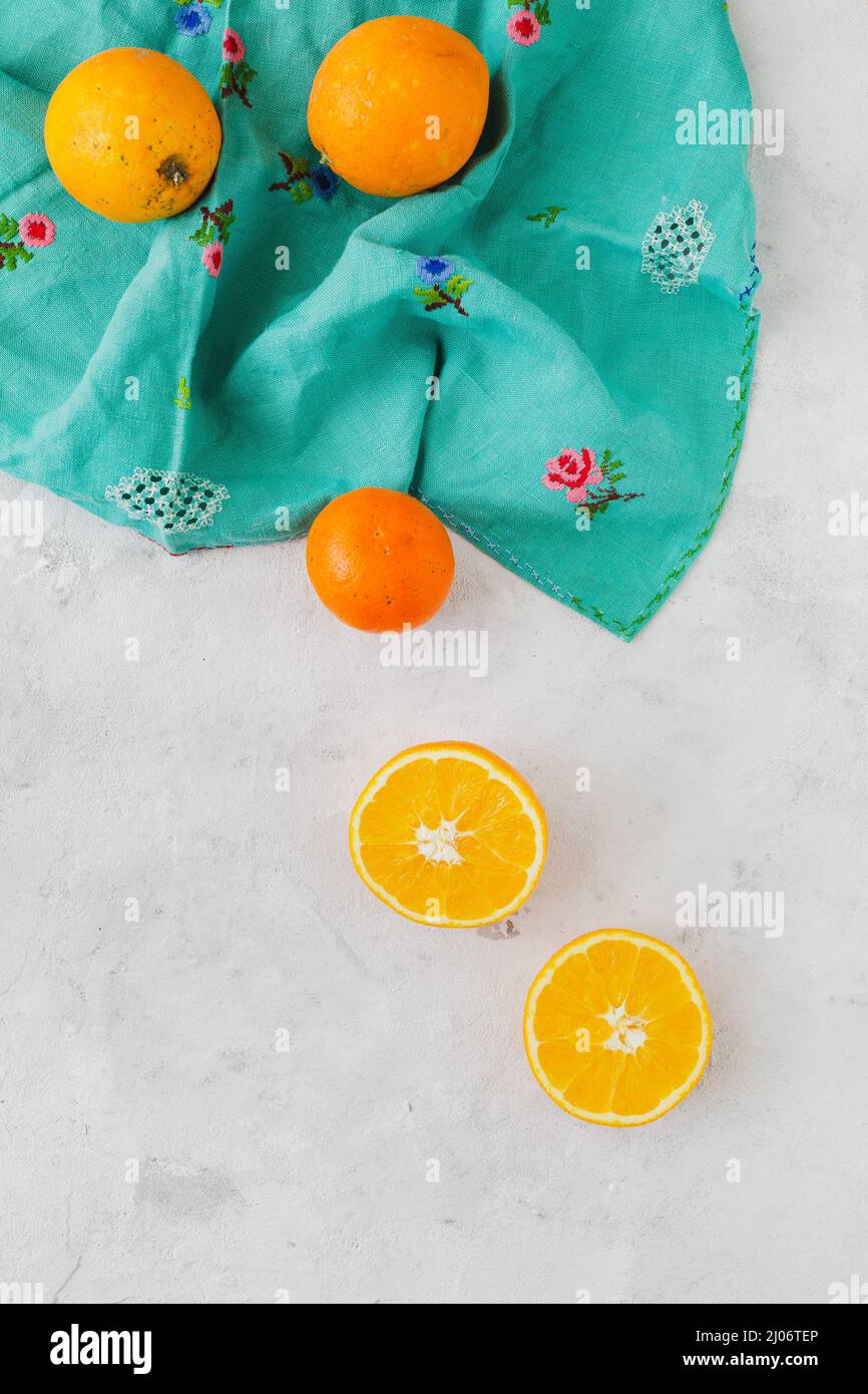 Overhead view of oranges with white background and vintage turquoise ...