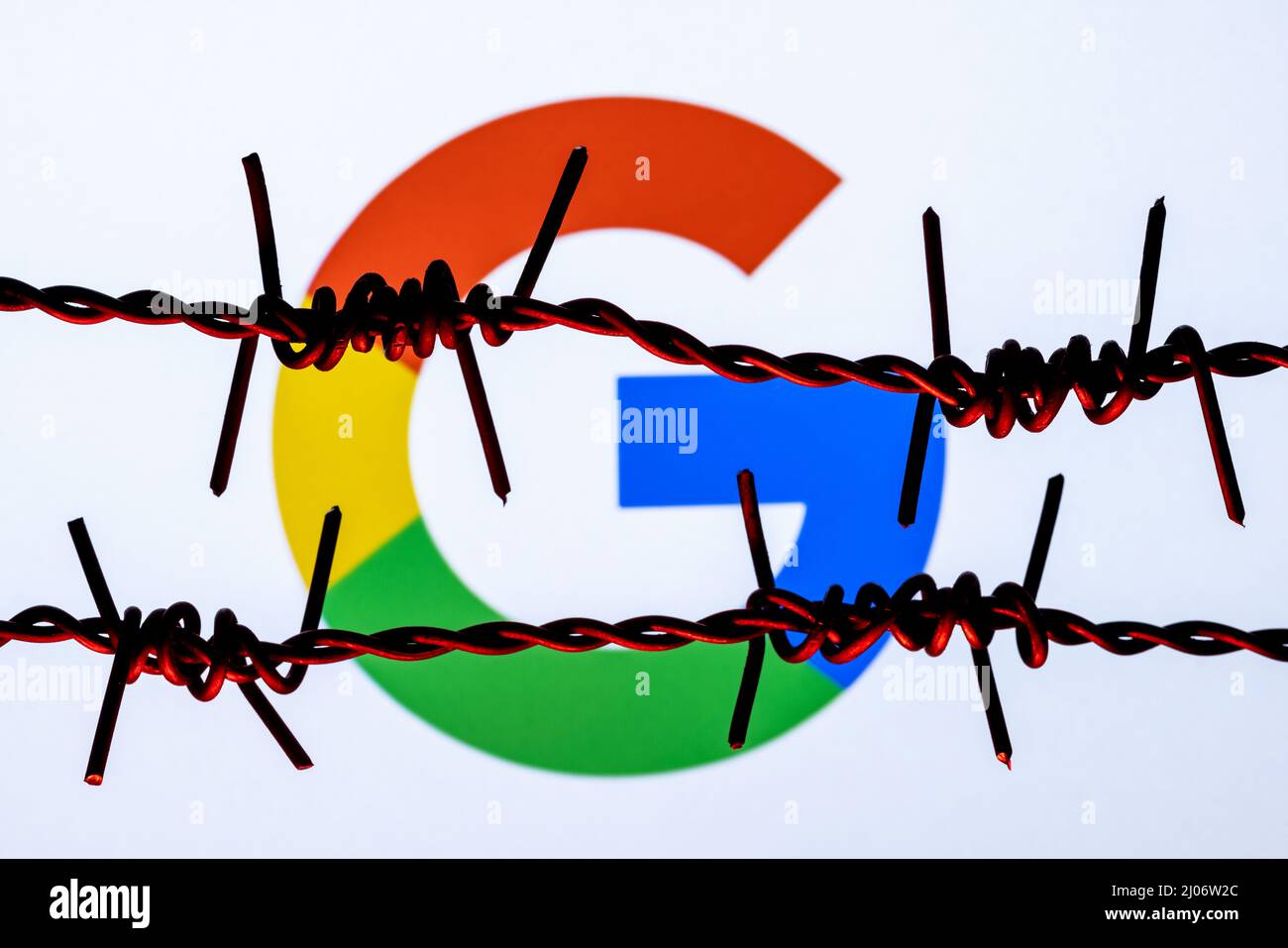 Google technology company logo behind barbed wire. The concept of ...