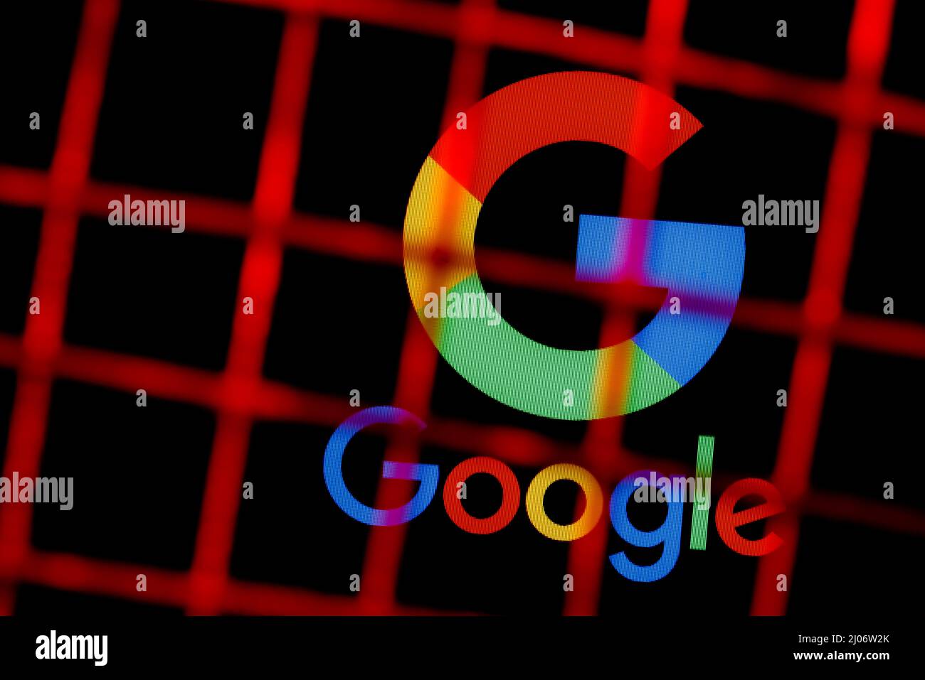 The logo of the technology company Google behind bars. The concept of ...