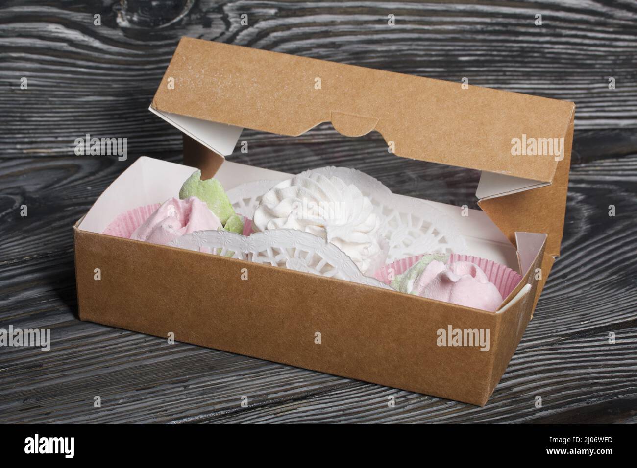 Homemade marshmallow. Marshmallow flowers. In craft boxes. On pine ...
