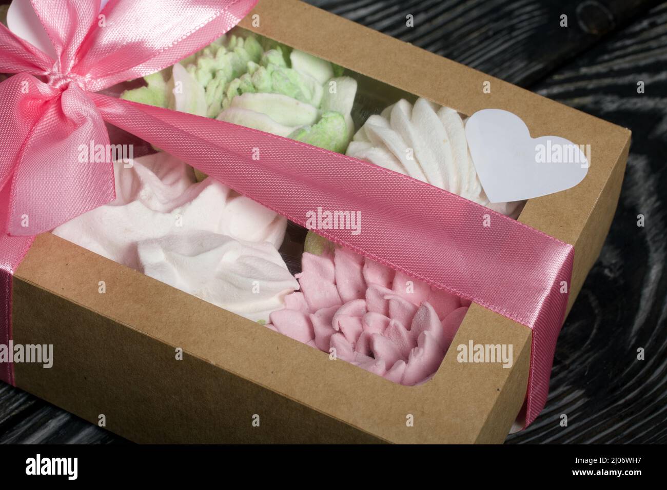 Homemade marshmallow. Marshmallow flowers. In craft boxes. On pine ...