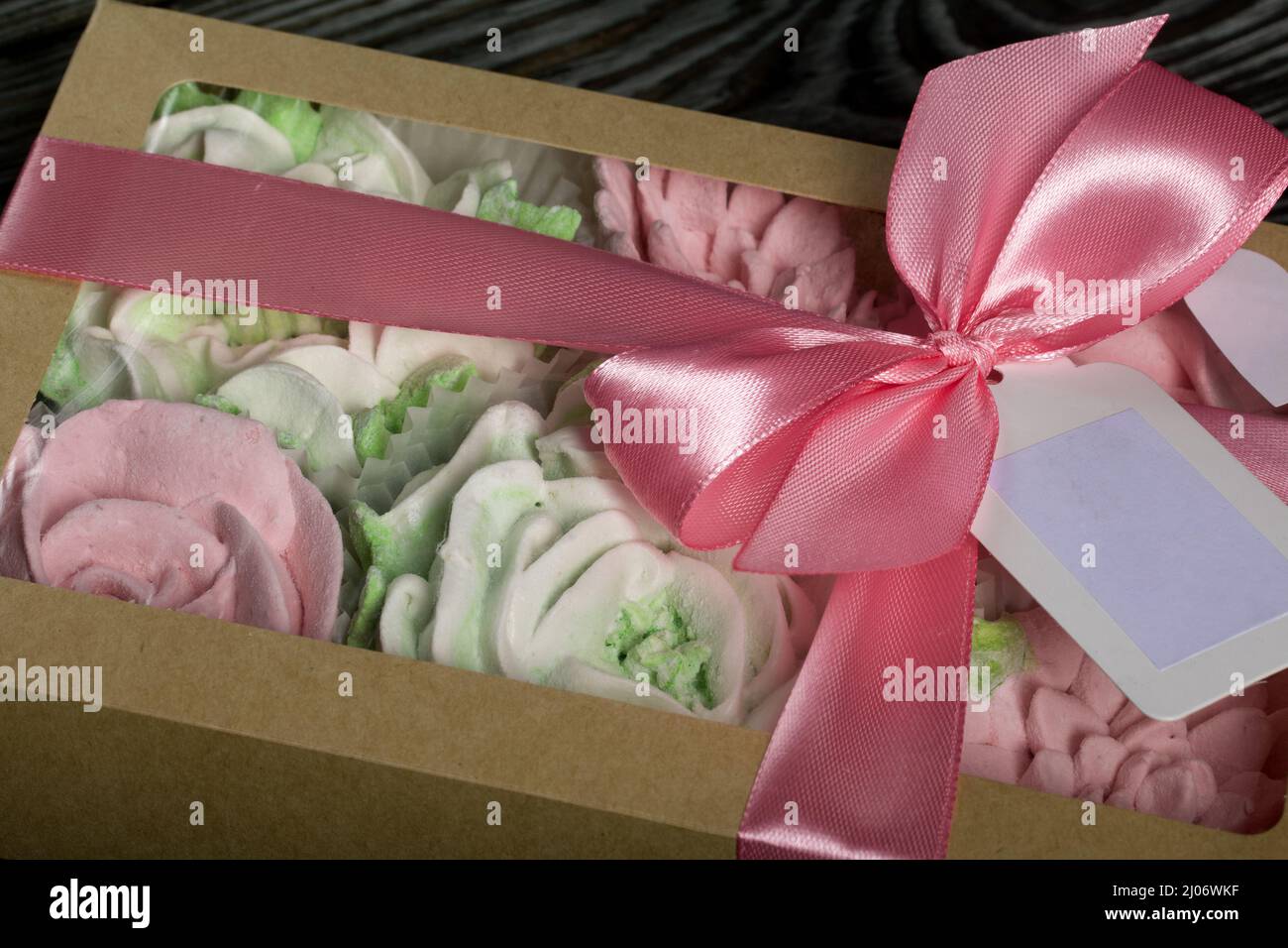 Homemade marshmallow. Marshmallow flowers. In craft boxes. On pine ...