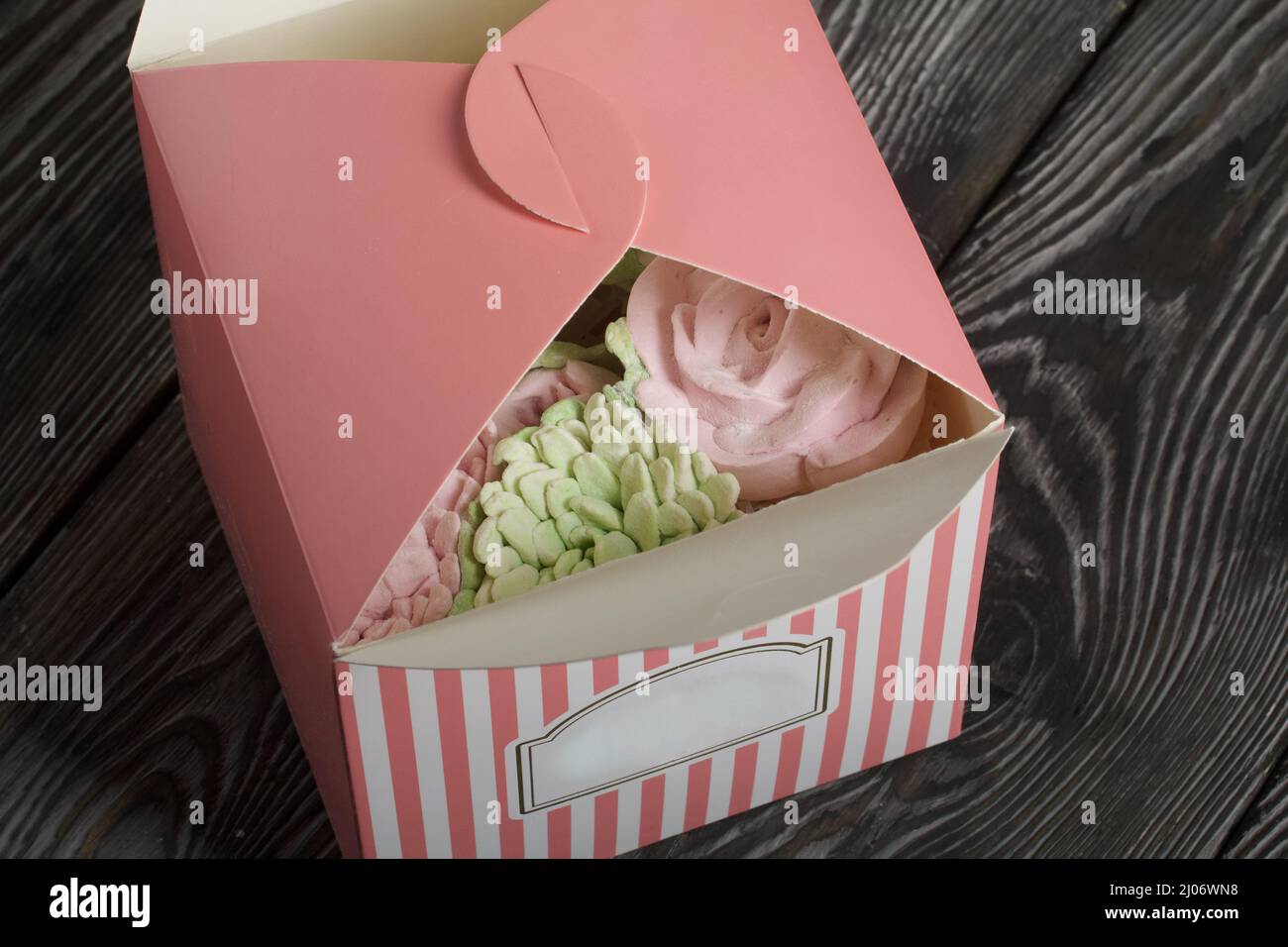 Homemade marshmallow. Marshmallow flowers. In craft boxes. On pine ...
