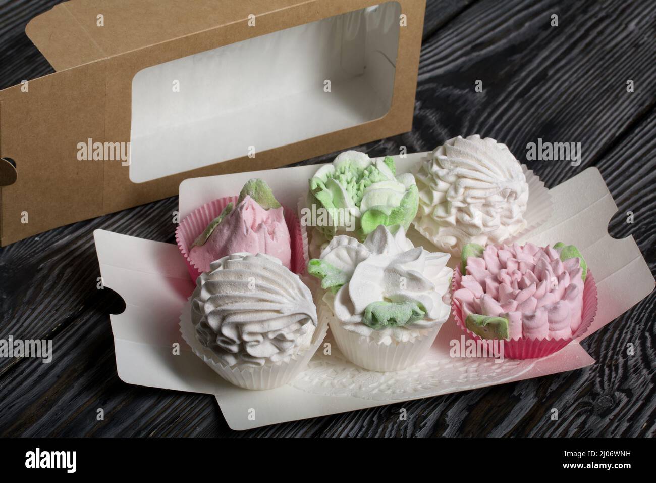 Homemade marshmallow. Marshmallow flowers. In craft boxes. On pine ...