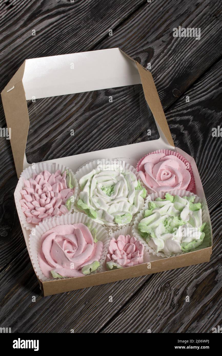 Homemade marshmallow. Marshmallow flowers. In craft boxes. On pine ...