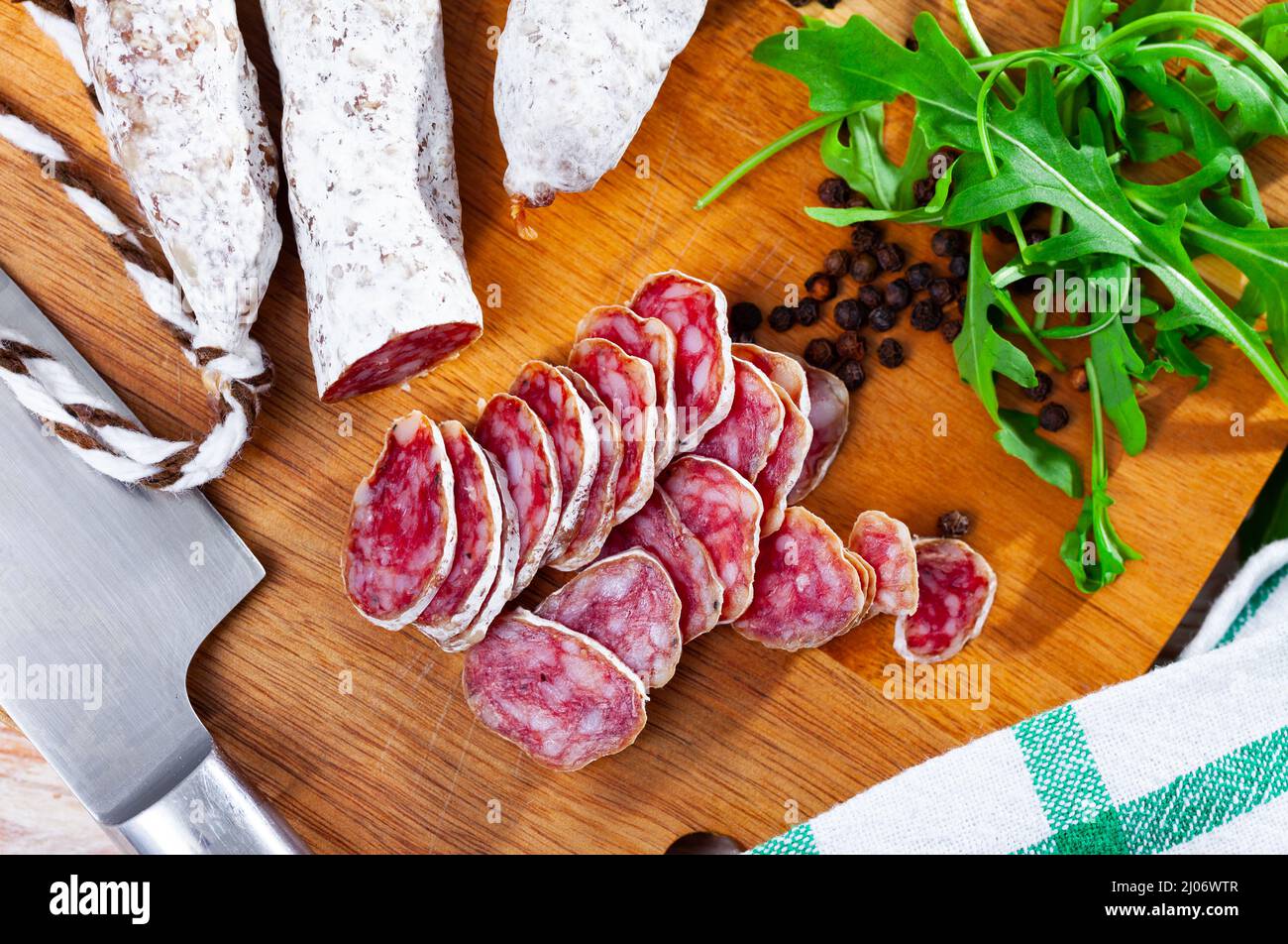 Fuet, traditional spanish smoked pork salami on a wooden kitchen board Stock Photo - Alamy