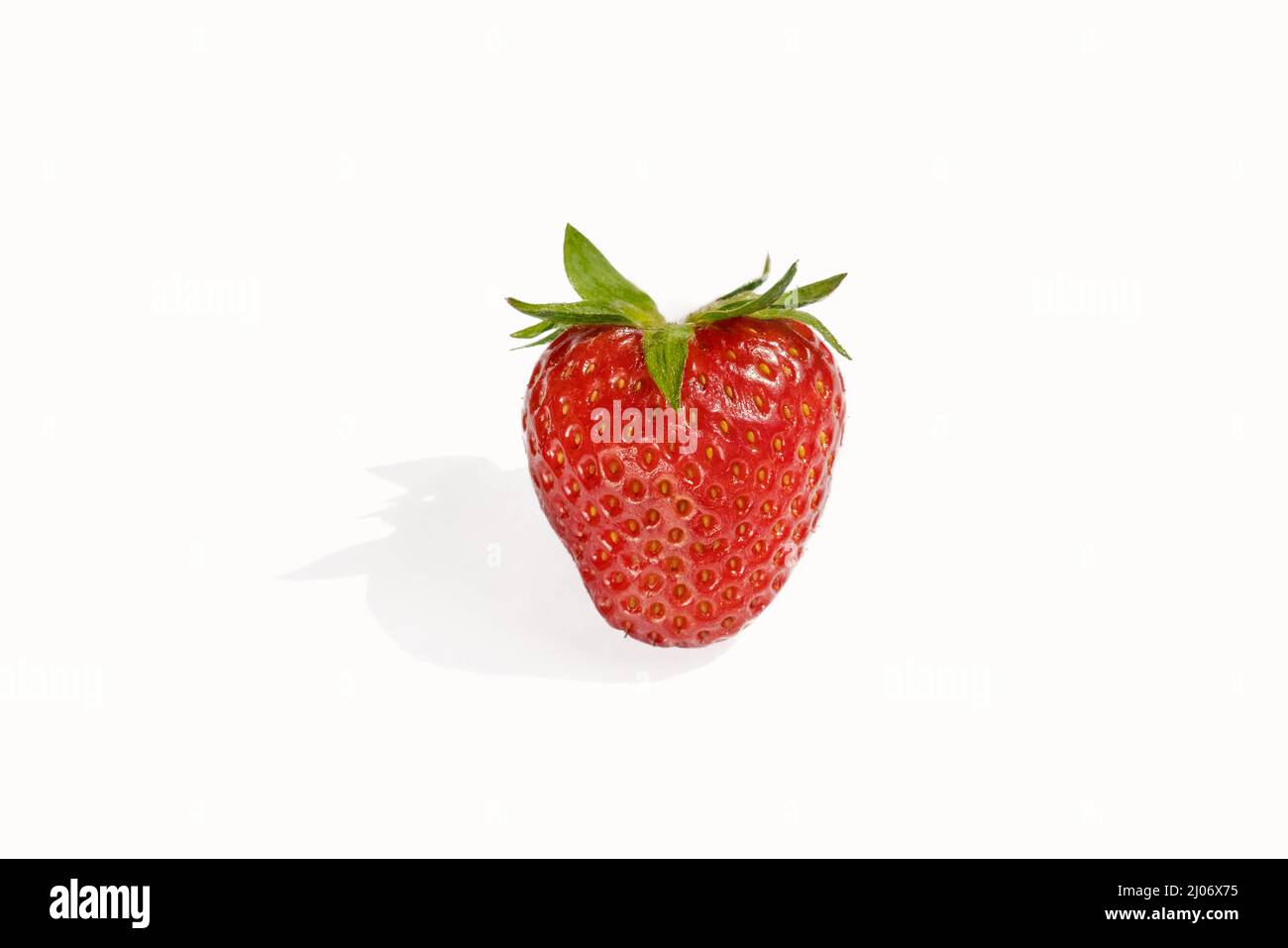 Strawberries isolated. Whole strawberries with leaves on a white ...