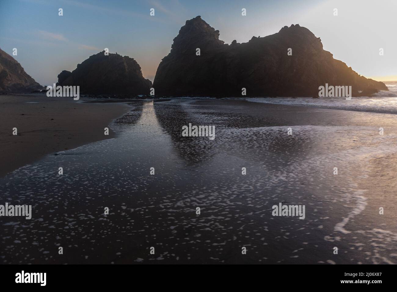 Impression of the keyhole arch rock at Pfeiffer beach around sunset ...