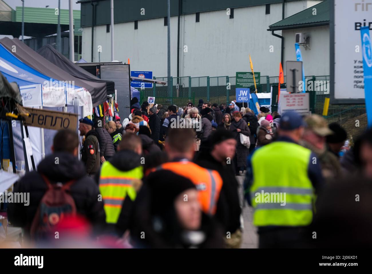 Ukrainians are seen crossing the border at Medyka, Poland, as they are ...