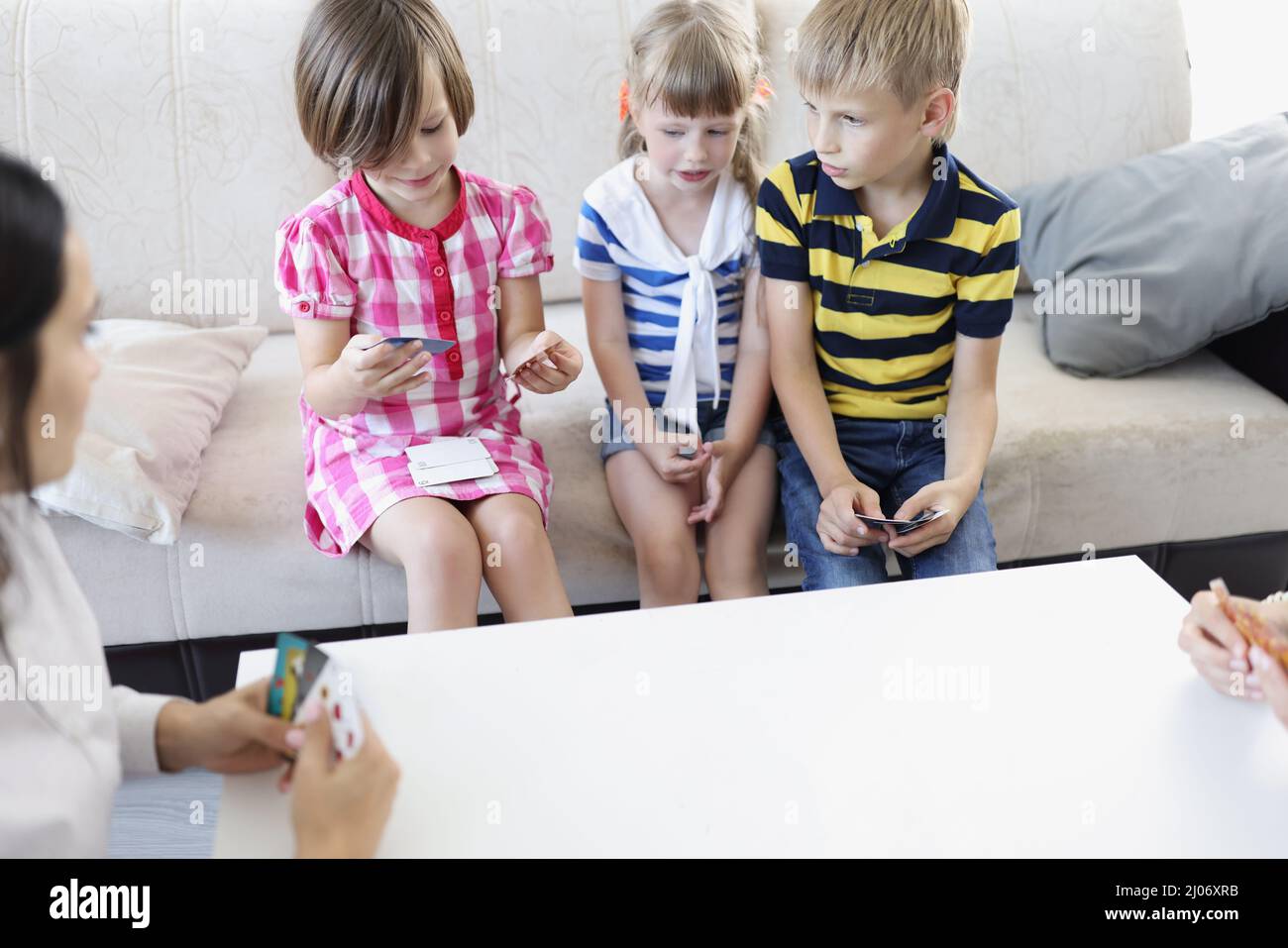 Group of kids play fun card game for development, interesting pastime ...