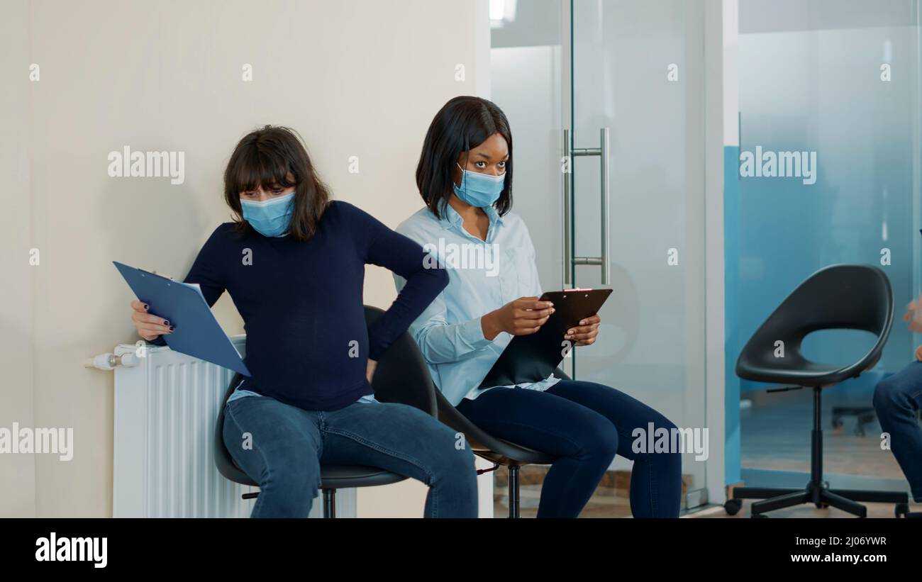 Asian employee taking pregnant candidate to attend job interview in ...