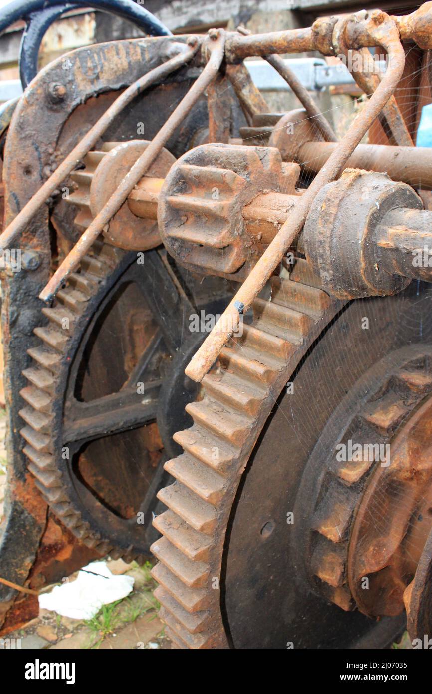brown rusty heavy gears of an old gearbox in closeup Stock Photo - Alamy