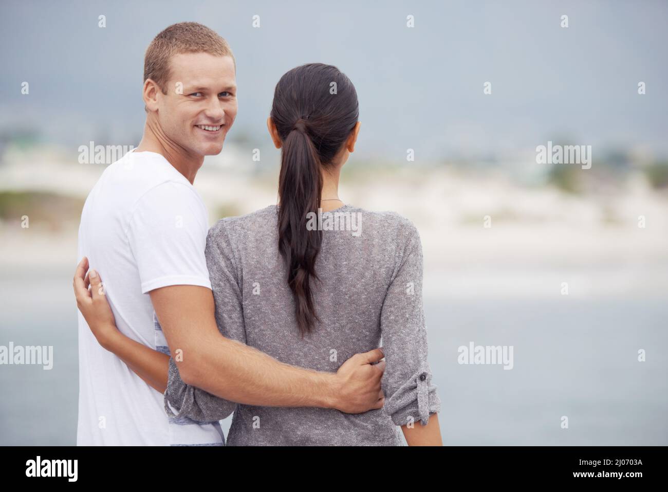 All that matters is that shes happy. Shot of a young couple looking at ...