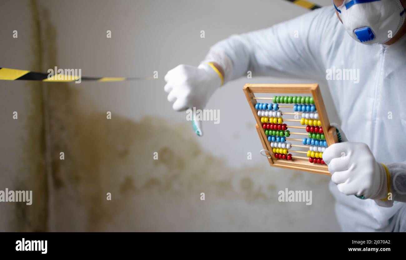 Man with white protective suit with abacus calculator, slide rule in ...