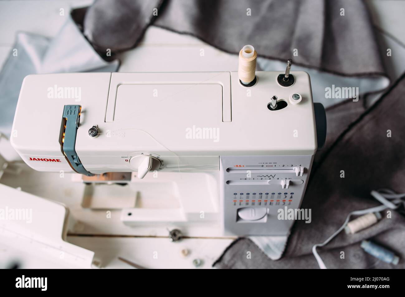 Sewing machine, accessories and fabric. Cozy creative sewing process at ...