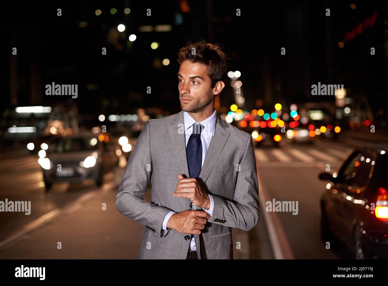 Suave in the city. A handsome businessman posing in the middle of a ...
