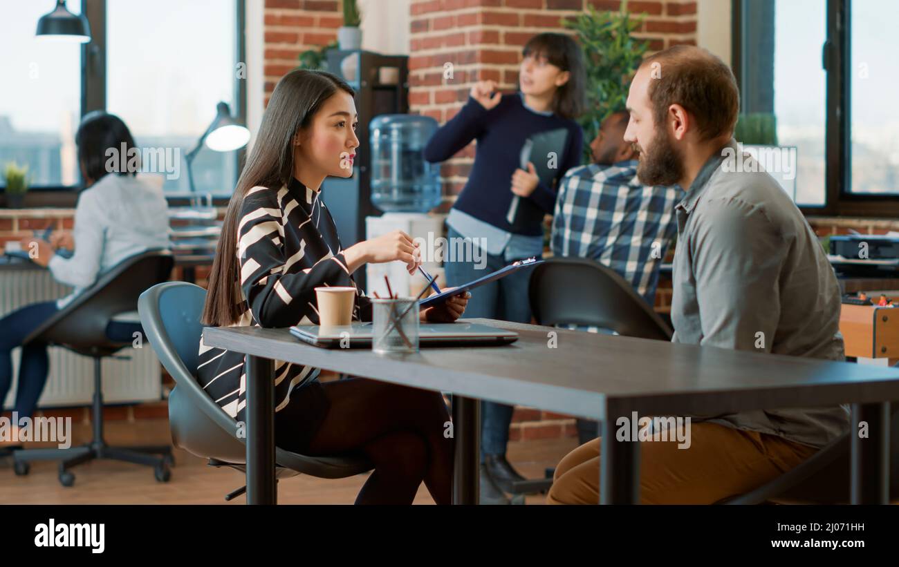 HR employee interviewing male applicant about work experience at ...