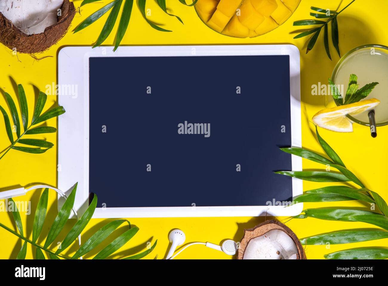 Simple high-colored summer holiday background. Tablet with empty screen ...