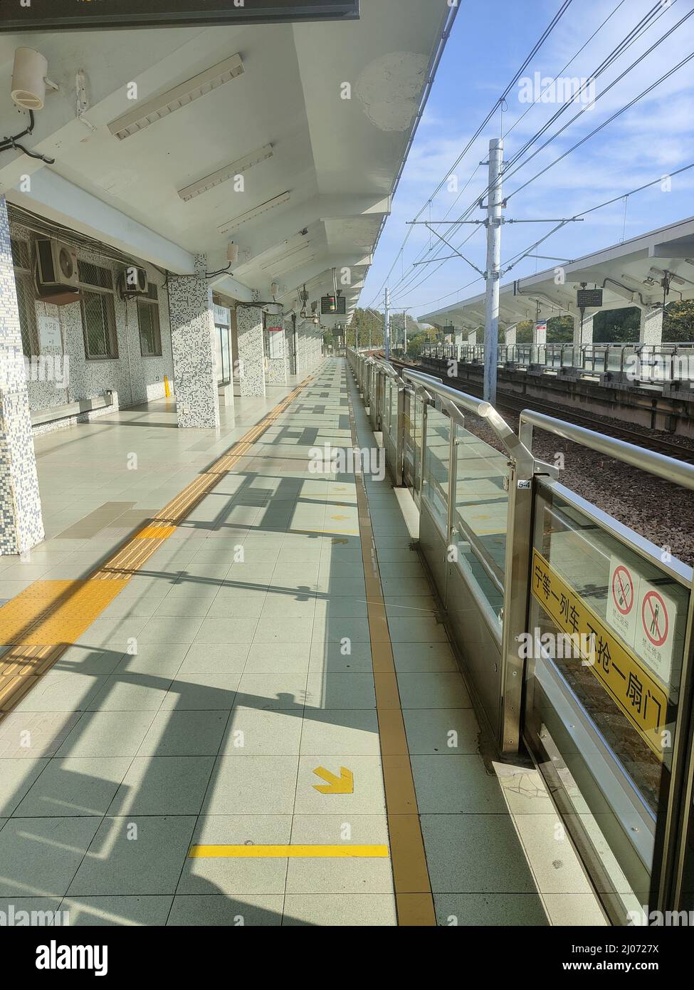 Railway station with the railings Stock Photo - Alamy