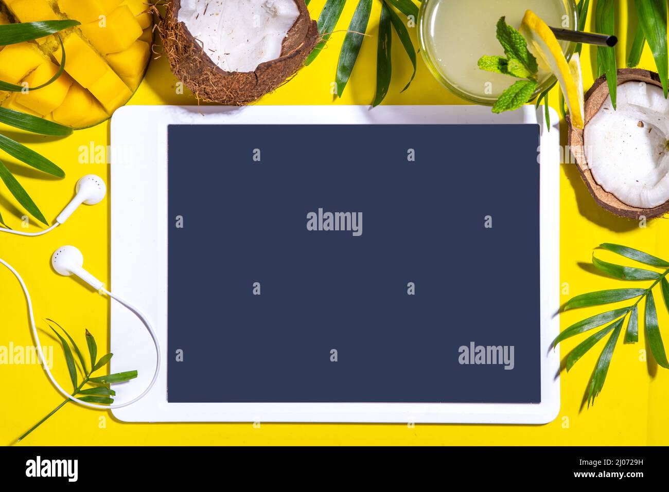 Simple high-colored summer holiday background. Tablet with empty screen ...