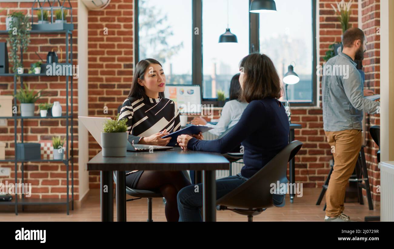 Candidate with resume attending job interview with HR recruiter, having ...