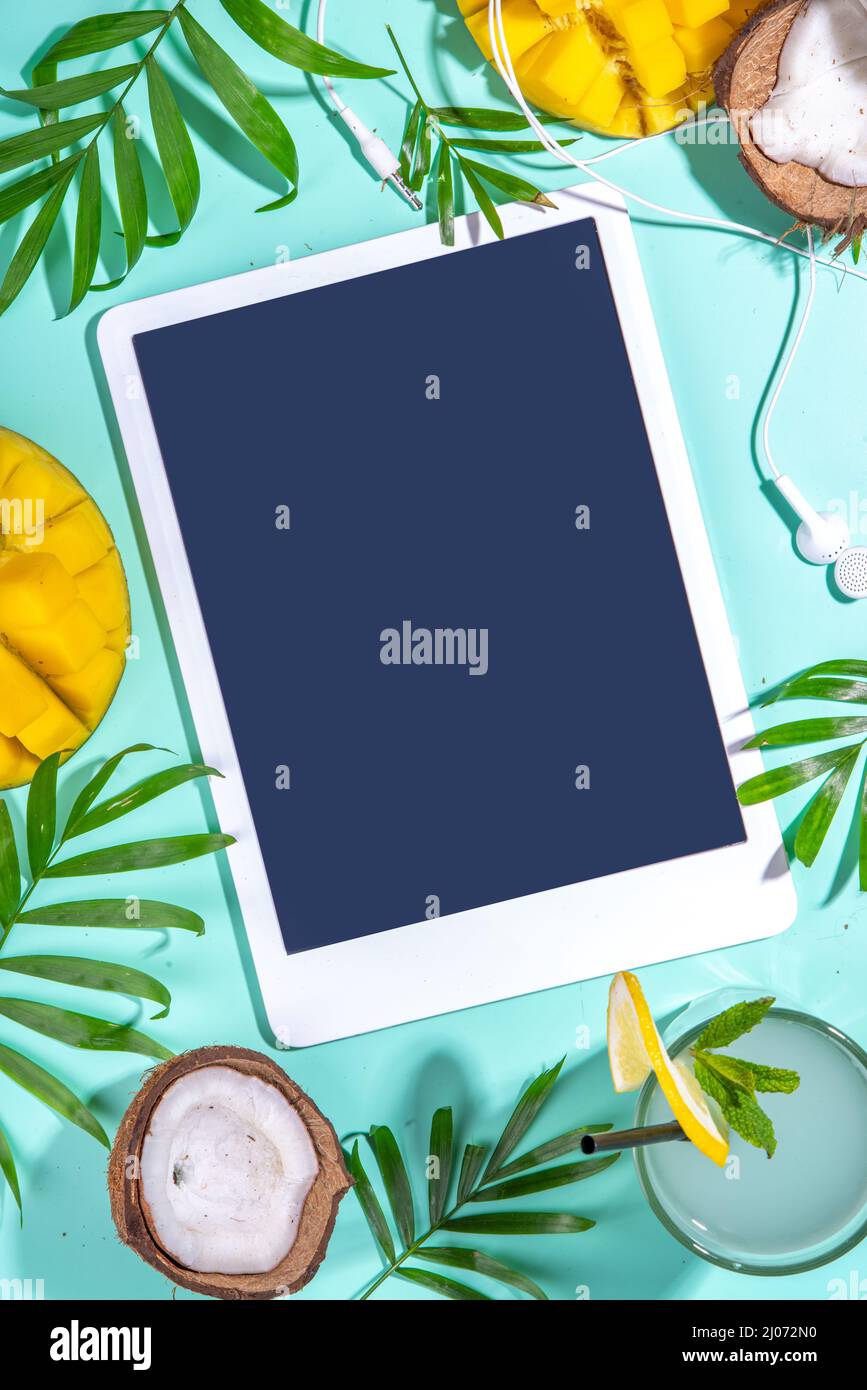 Simple high-colored summer holiday background. Tablet with empty screen ...