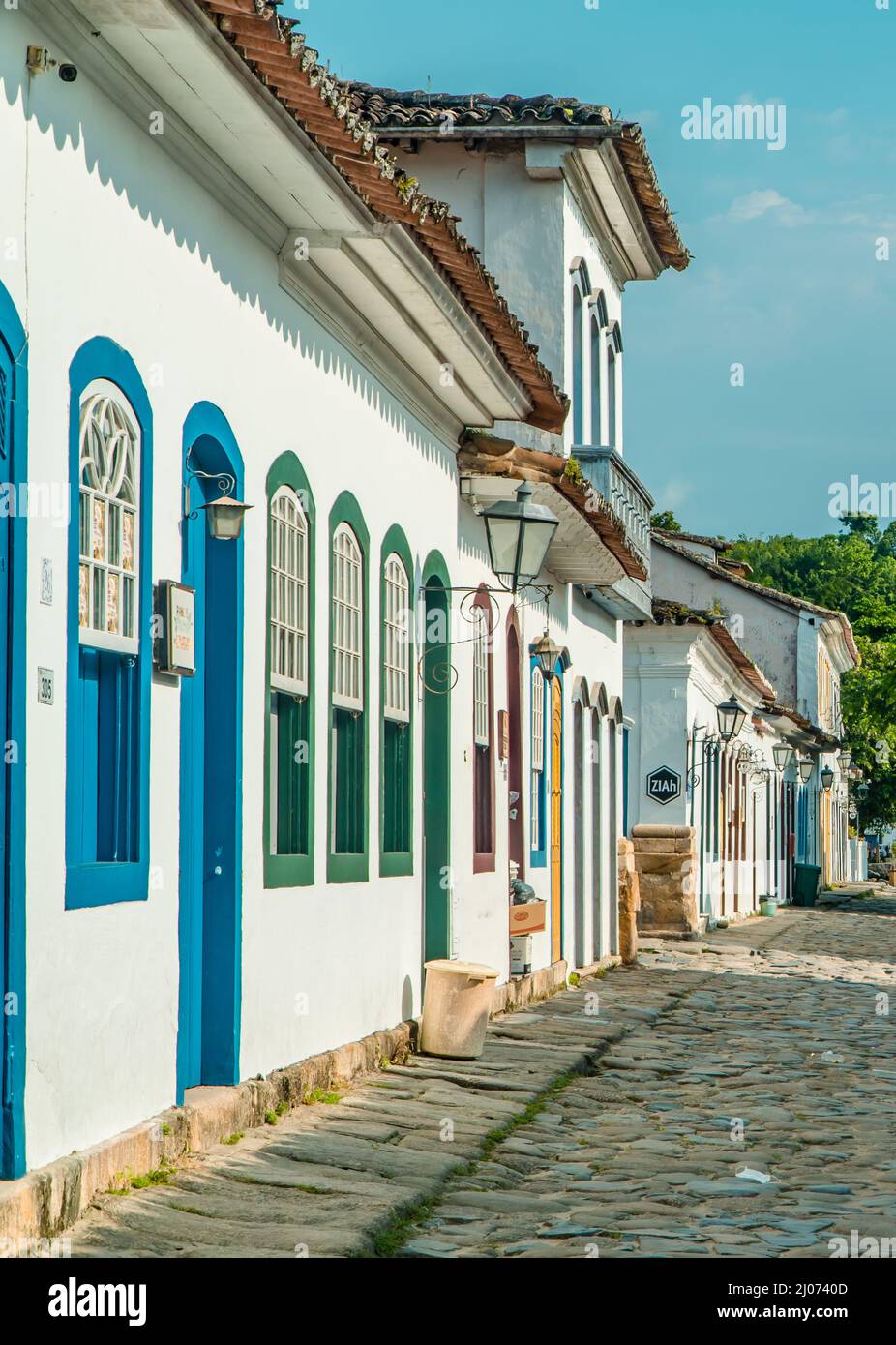Vertical street view of beautiful ancient colonial houses in the ...