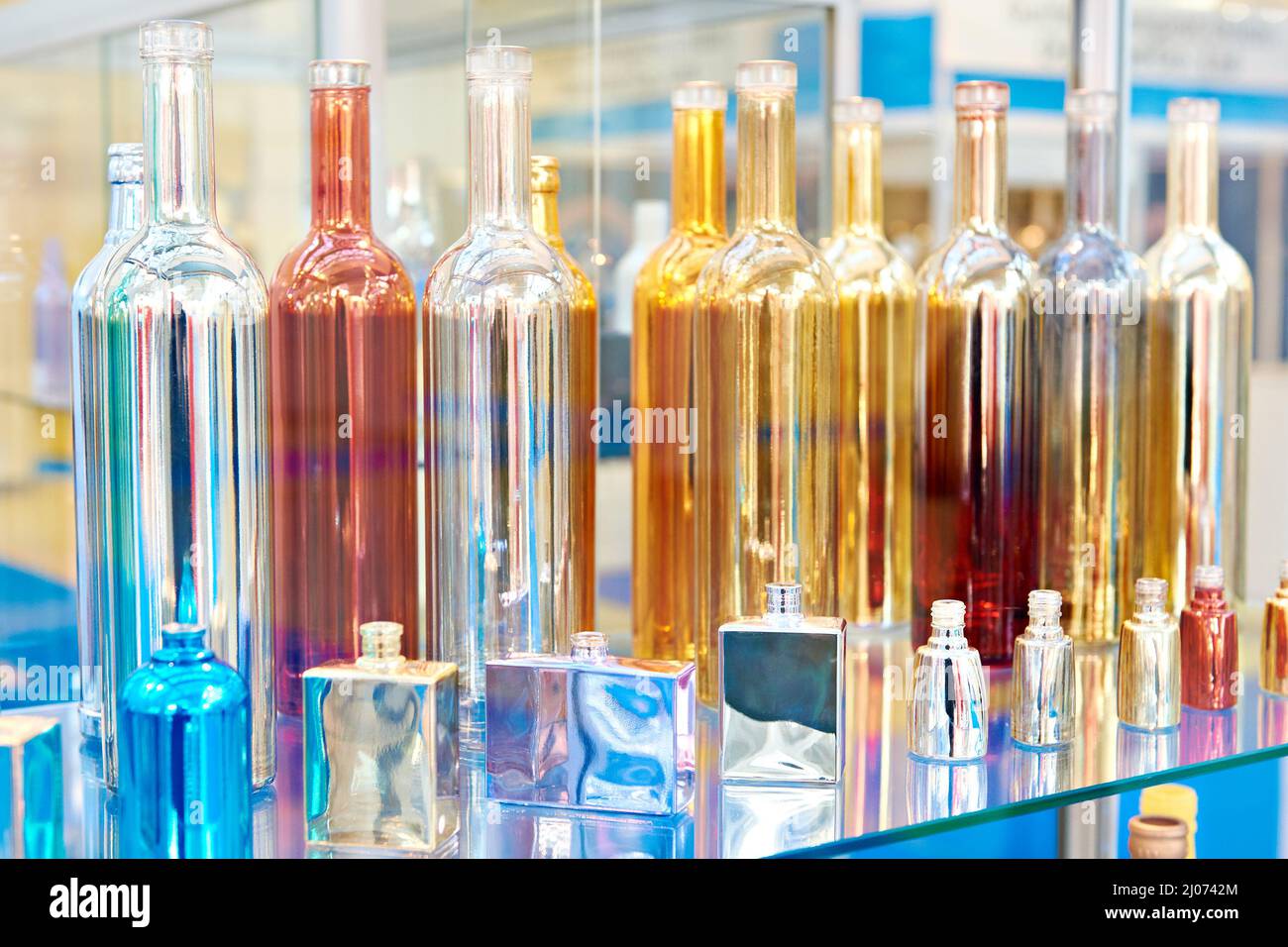 Colored reflex bottles on the shop window Stock Photo - Alamy
