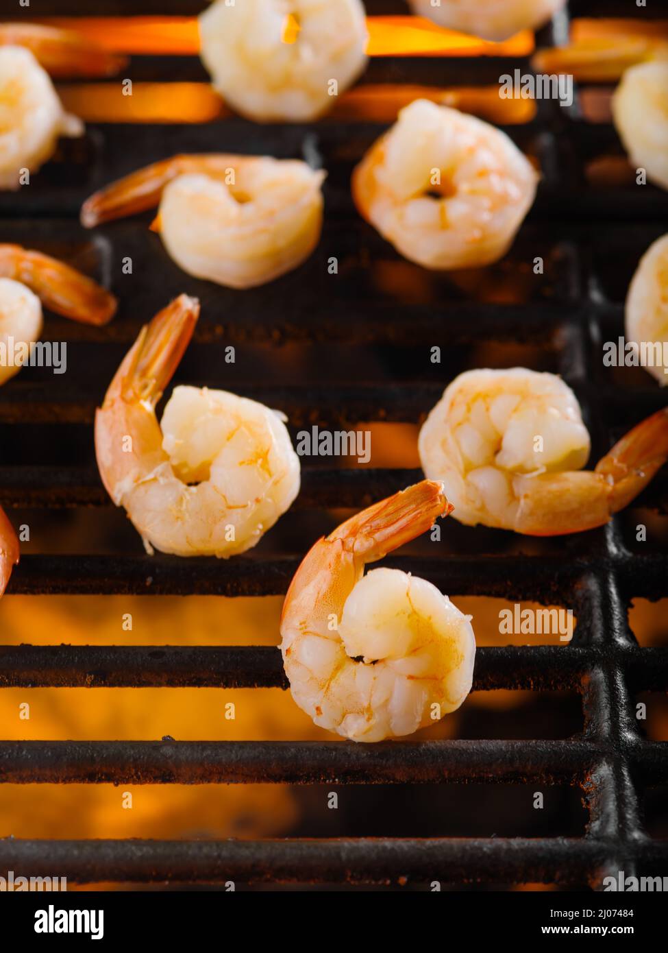 Shrimp on grill under fire.Process of cooking seafood. healthy food ...