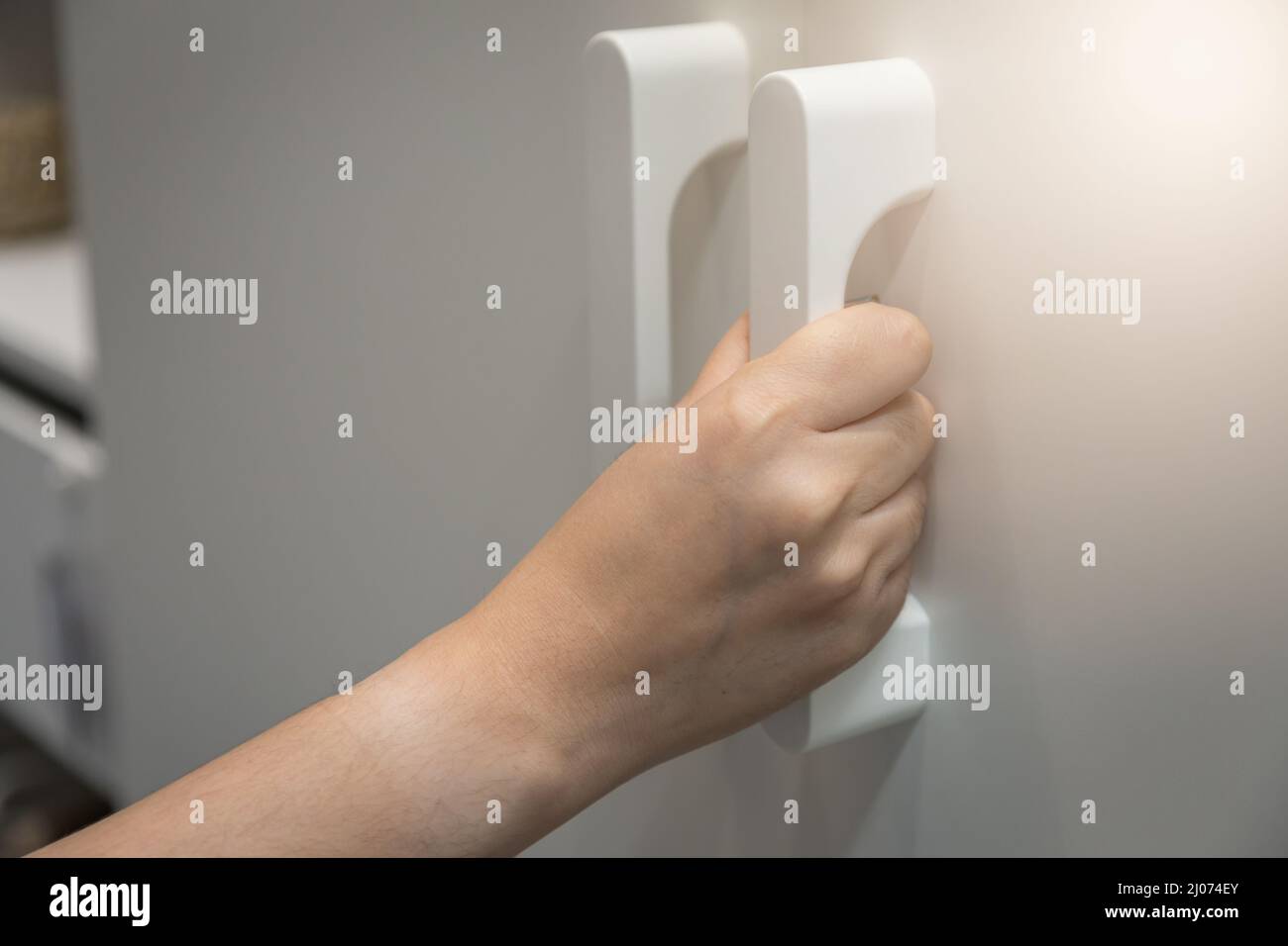 Woman hand open wardrobe use for background Stock Photo - Alamy