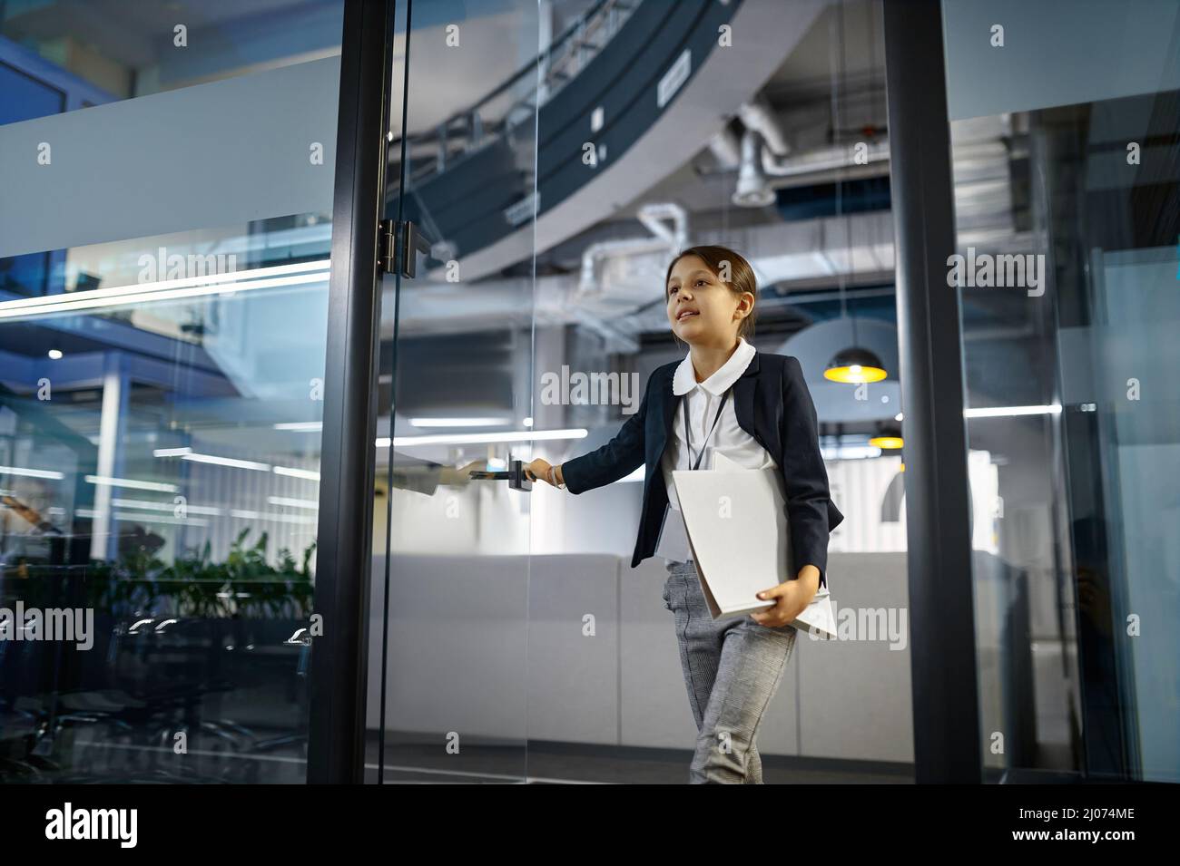 Business girl entering conference room with smile Stock Photo - Alamy