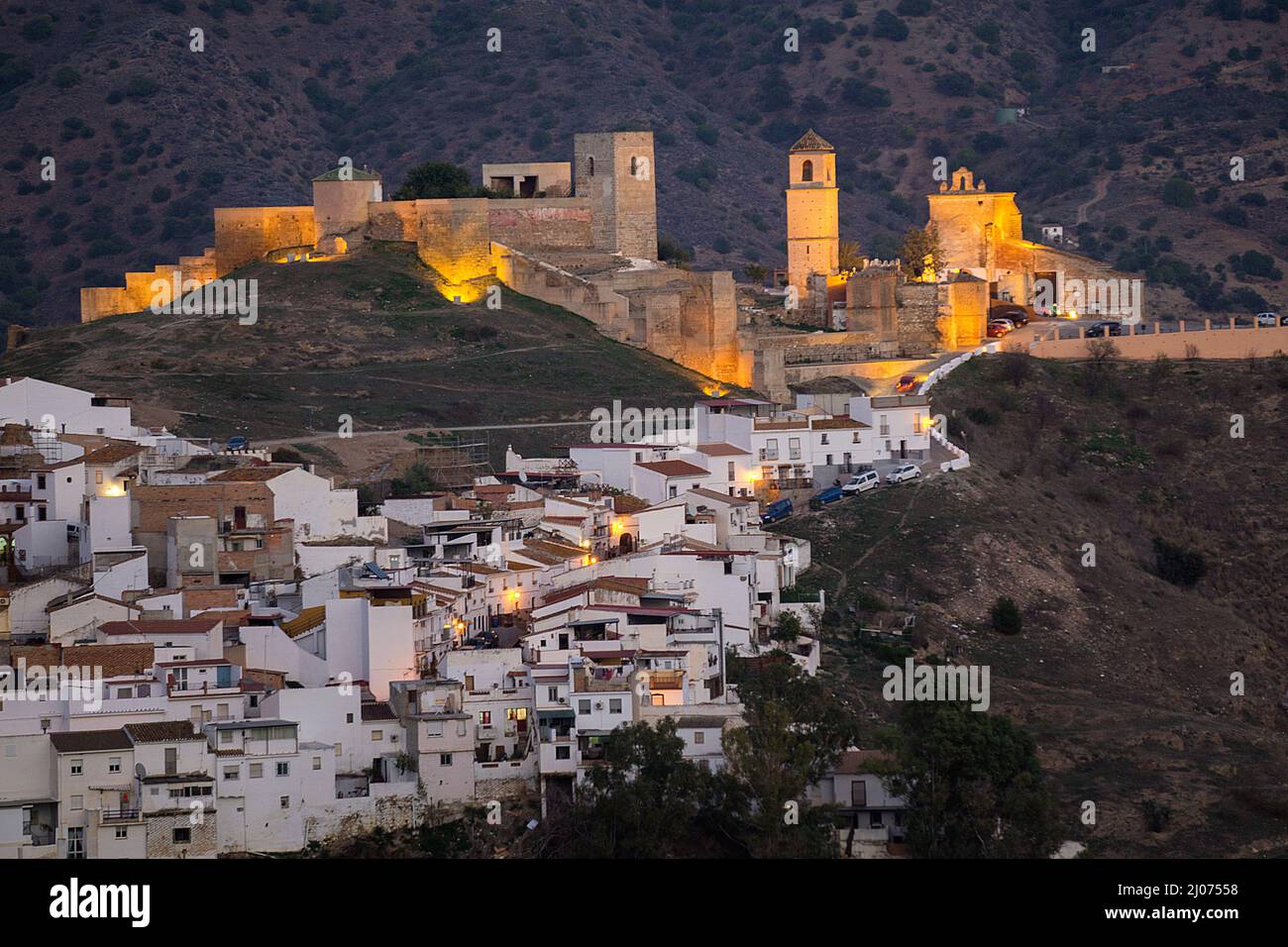 The illuminated arabic castle of Alora, pueblo blanco, Malaga province ...