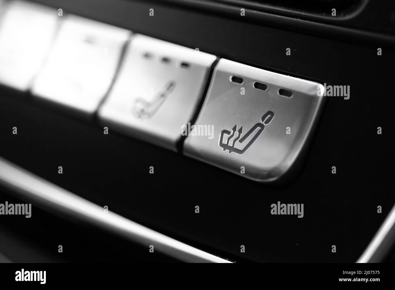 Heated seats buttons inside car. Seat heating buttons control panel in ...
