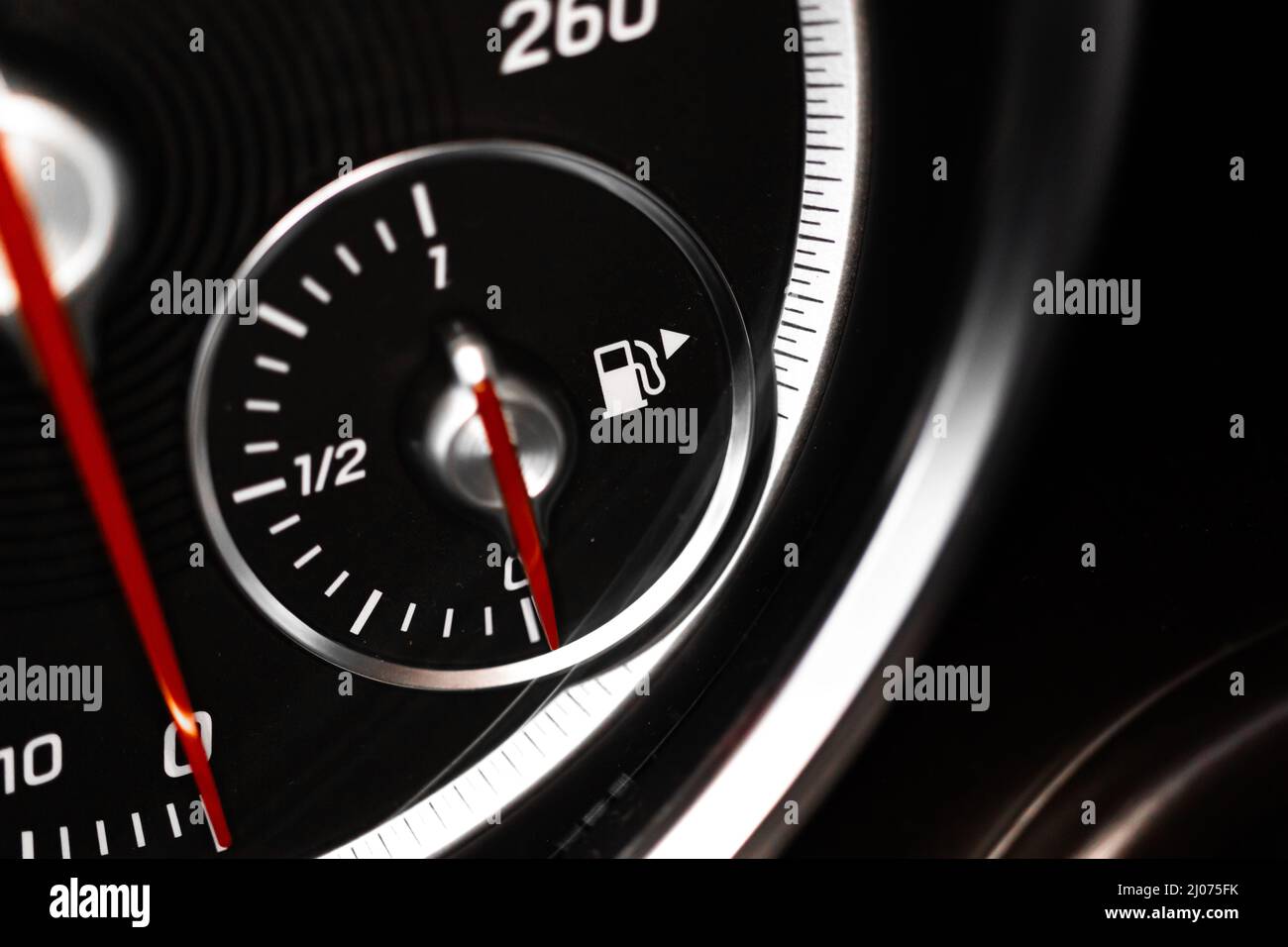 Low fuel gauge showing fuel dashboard, glowing indicator, close-up ...