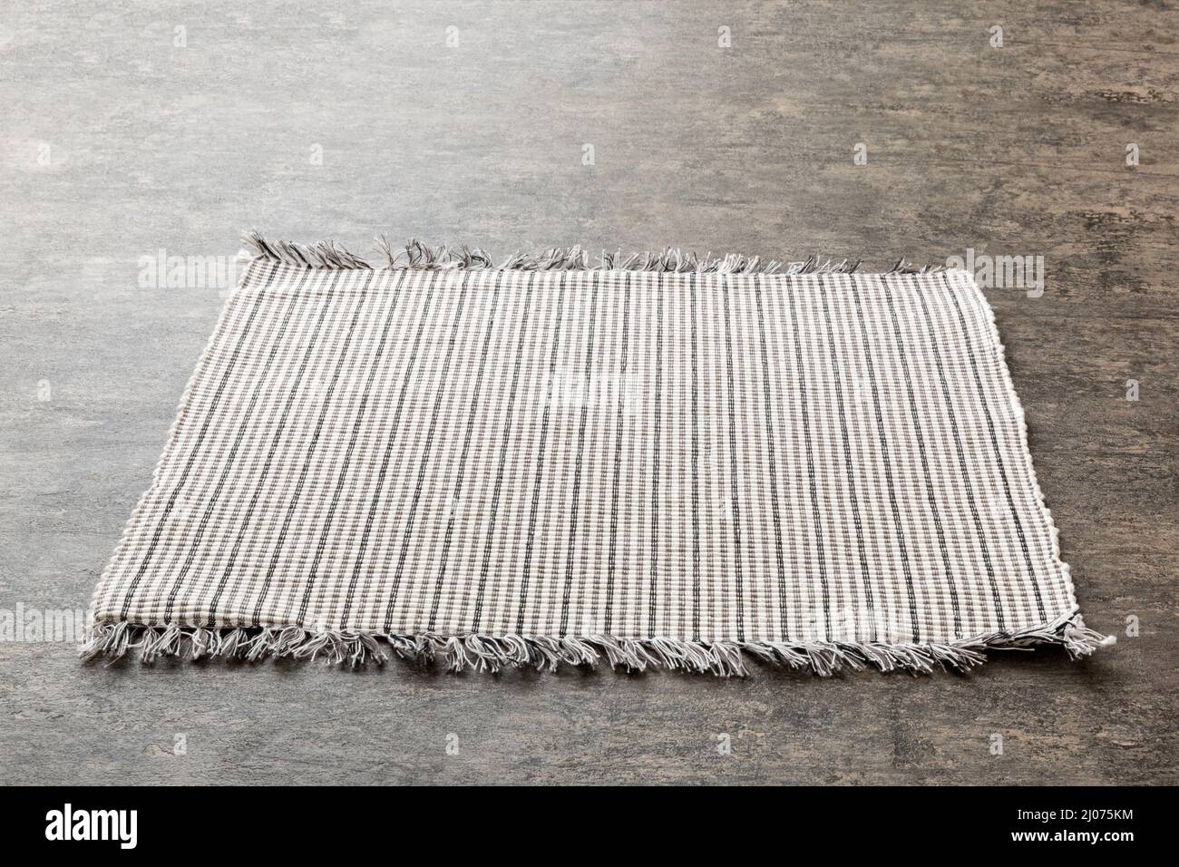 Perspective view of grey tablecloth for food on cement background ...